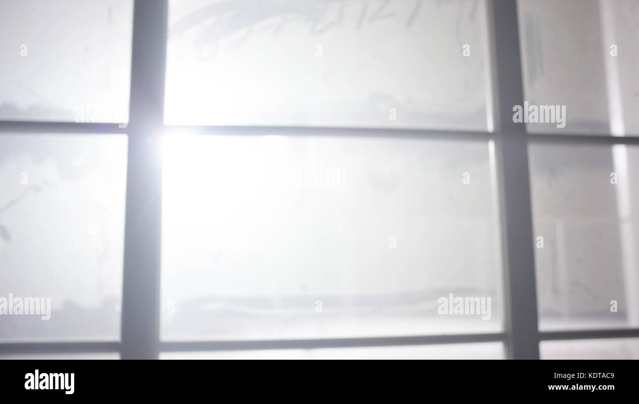 Bright white light outside the window. Spotlight outside the window ...