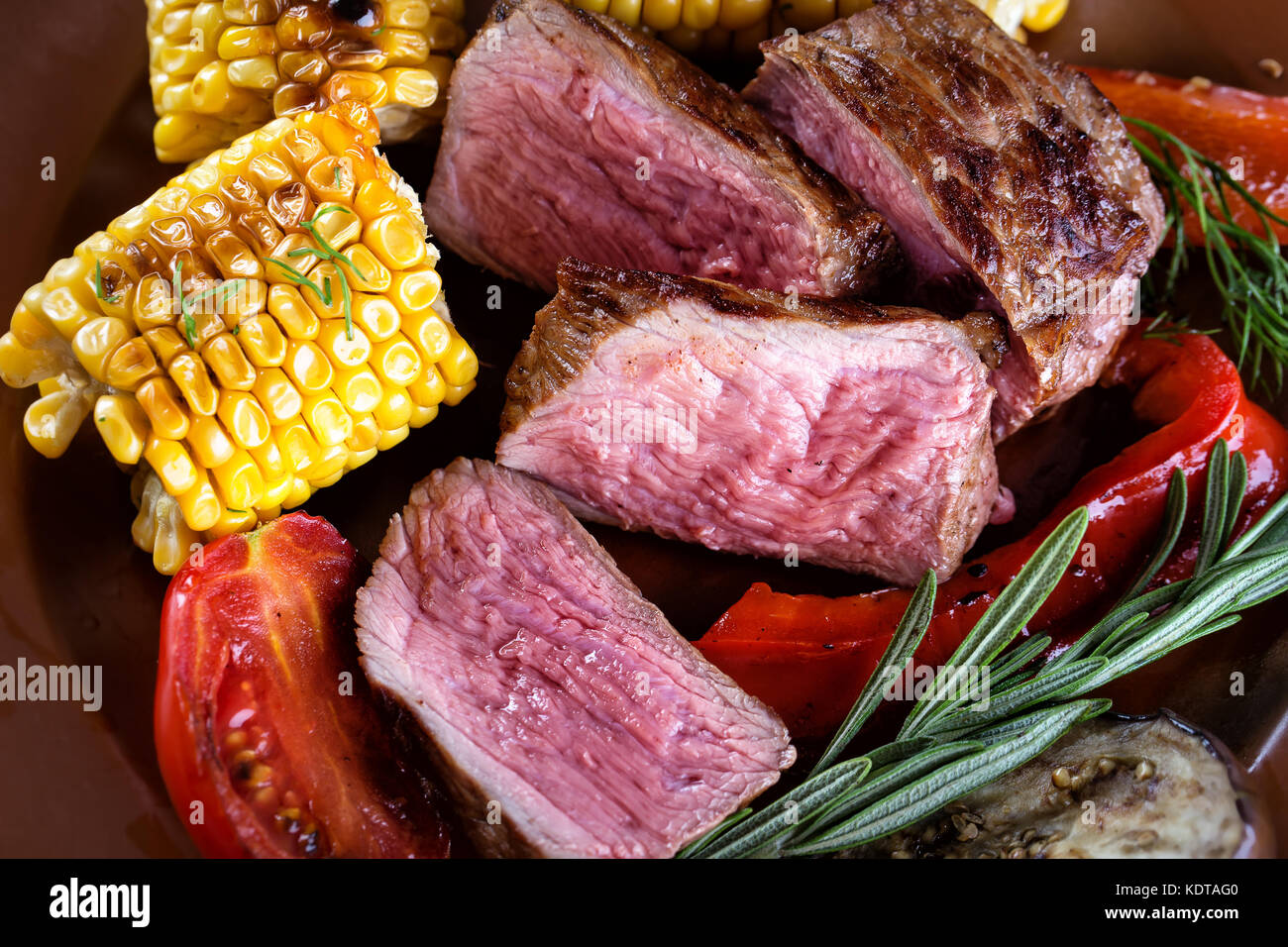 Sliced fried meat with vegetables Stock Photo - Alamy