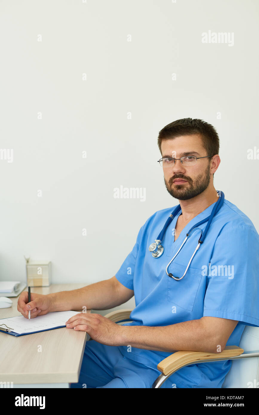 Experienced Doctor Posing in Office Stock Photo - Alamy