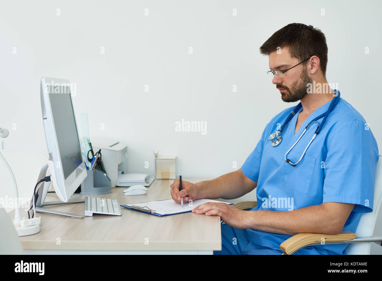 Doctor Filling Patients Records Stock Photo - Alamy