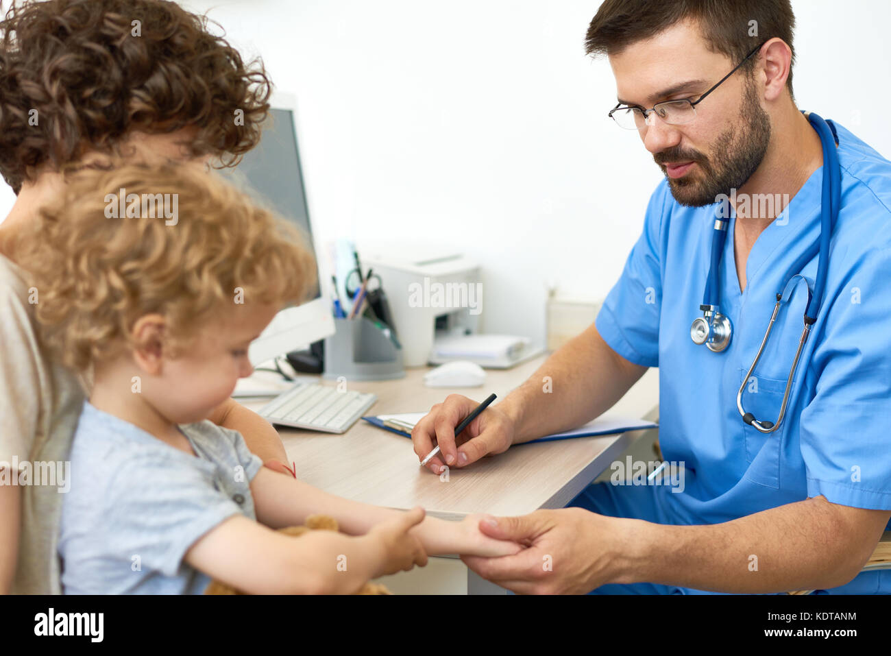 Pediatrician with Child in Office Stock Photo - Alamy
