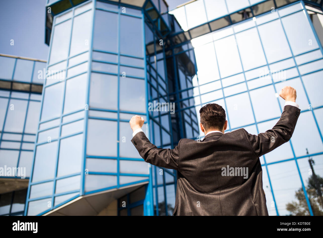 Cheerful young Business Man Celebrating Success Outdoors Stock Photo ...