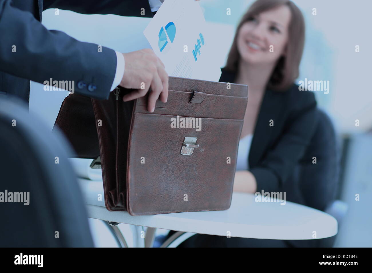 Cropped image of business woman getting documents out of briefca Stock ...