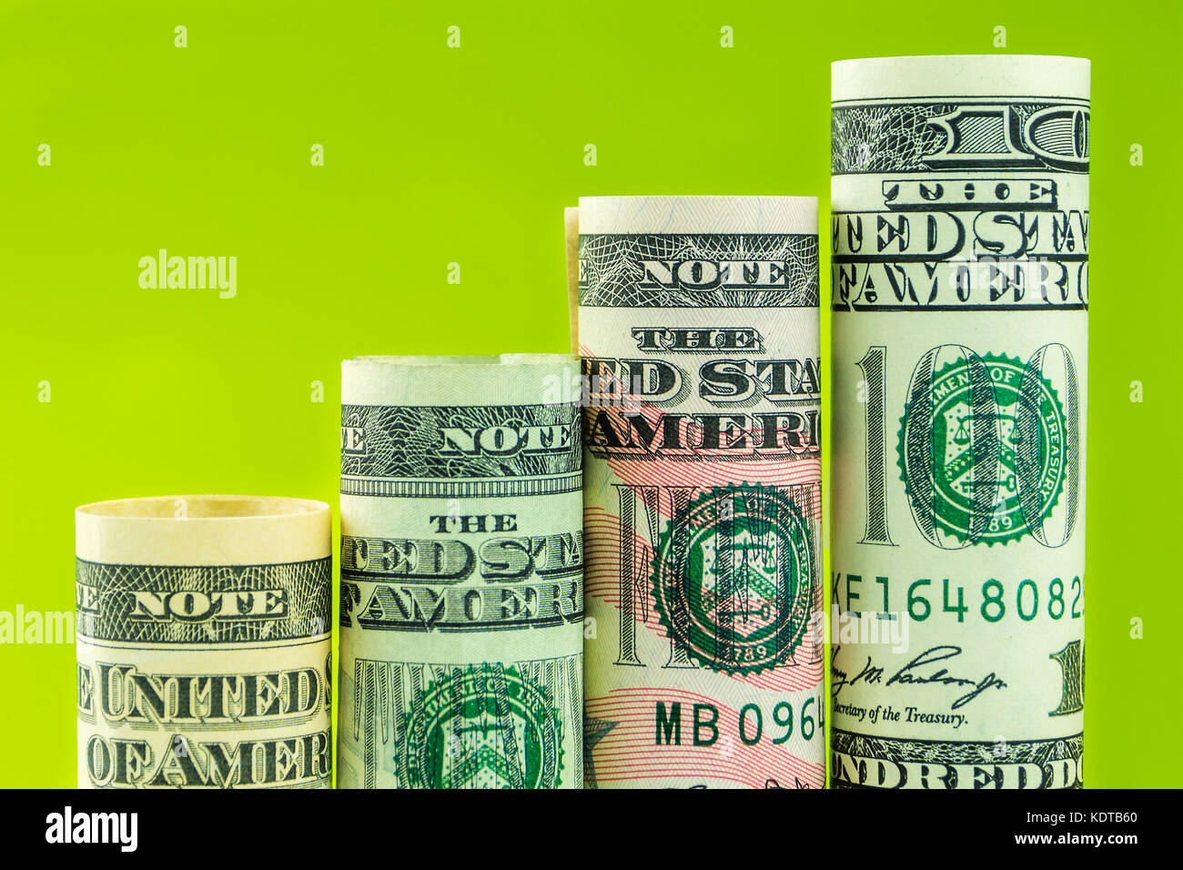 rising steps made of rolls of four most valued american dollar ...