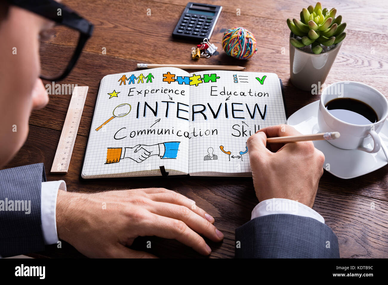 Close-Up Of Businessman Working On Interview Concept On Notebook At ...