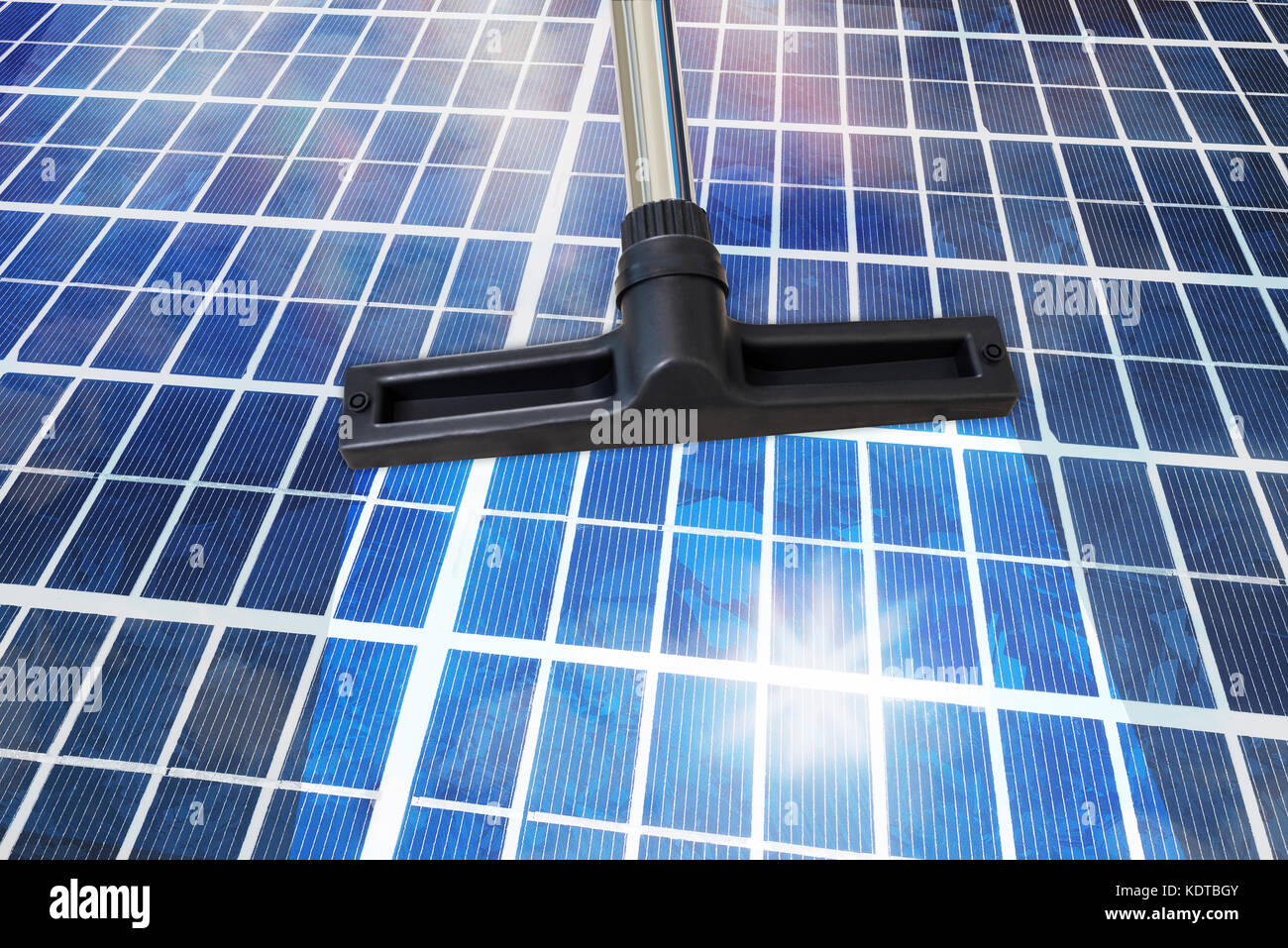 Close-Up Of A Cleansing Tool On Shiny Solar Panel Roof. Sustainable ...