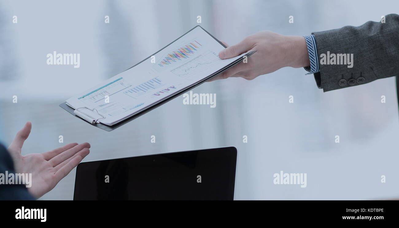 Businessman his colleague giving contract to read and sign Stock Photo ...