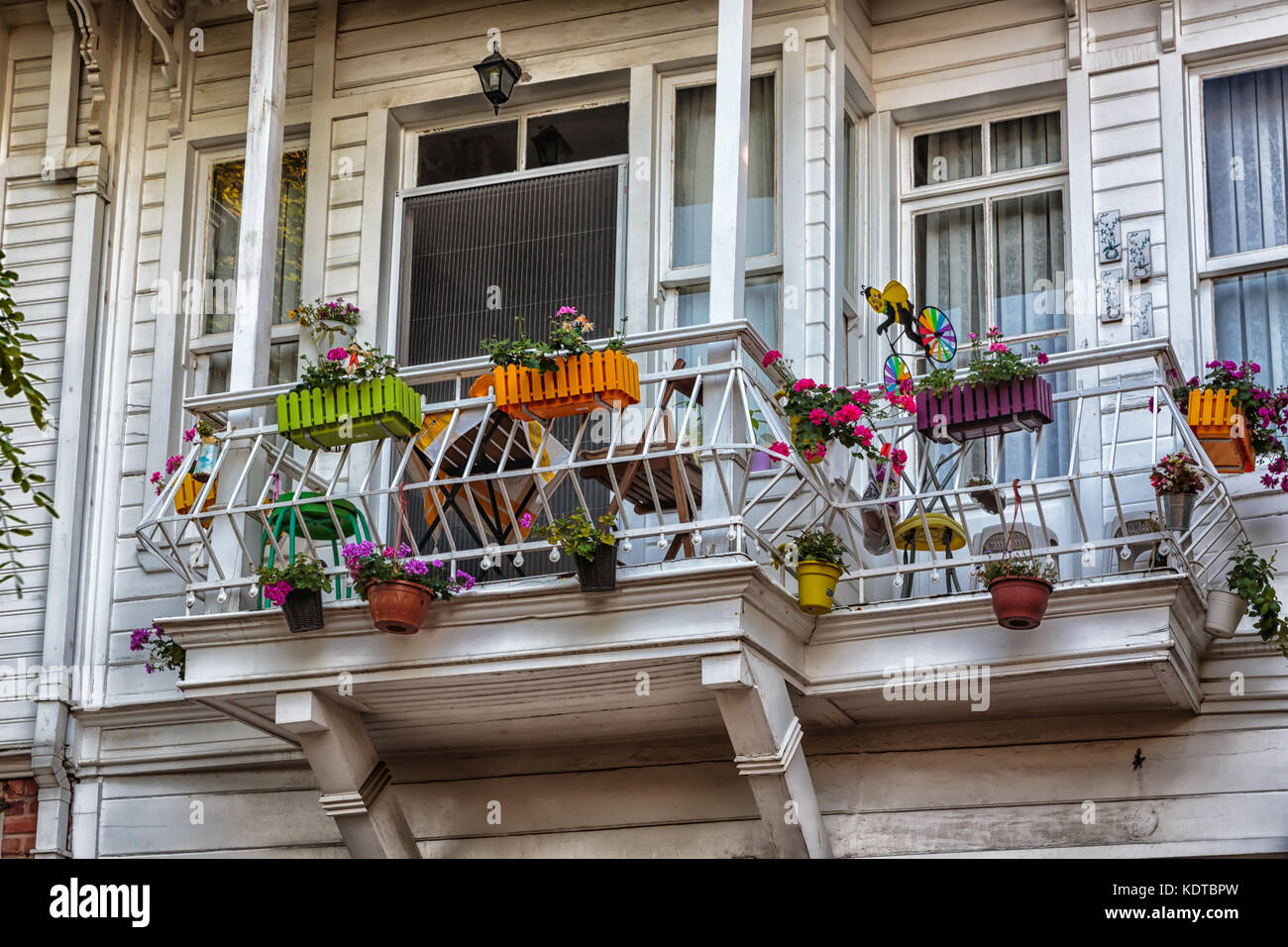 Beautiful white wooden balcony with flowers Stock Photo - Alamy