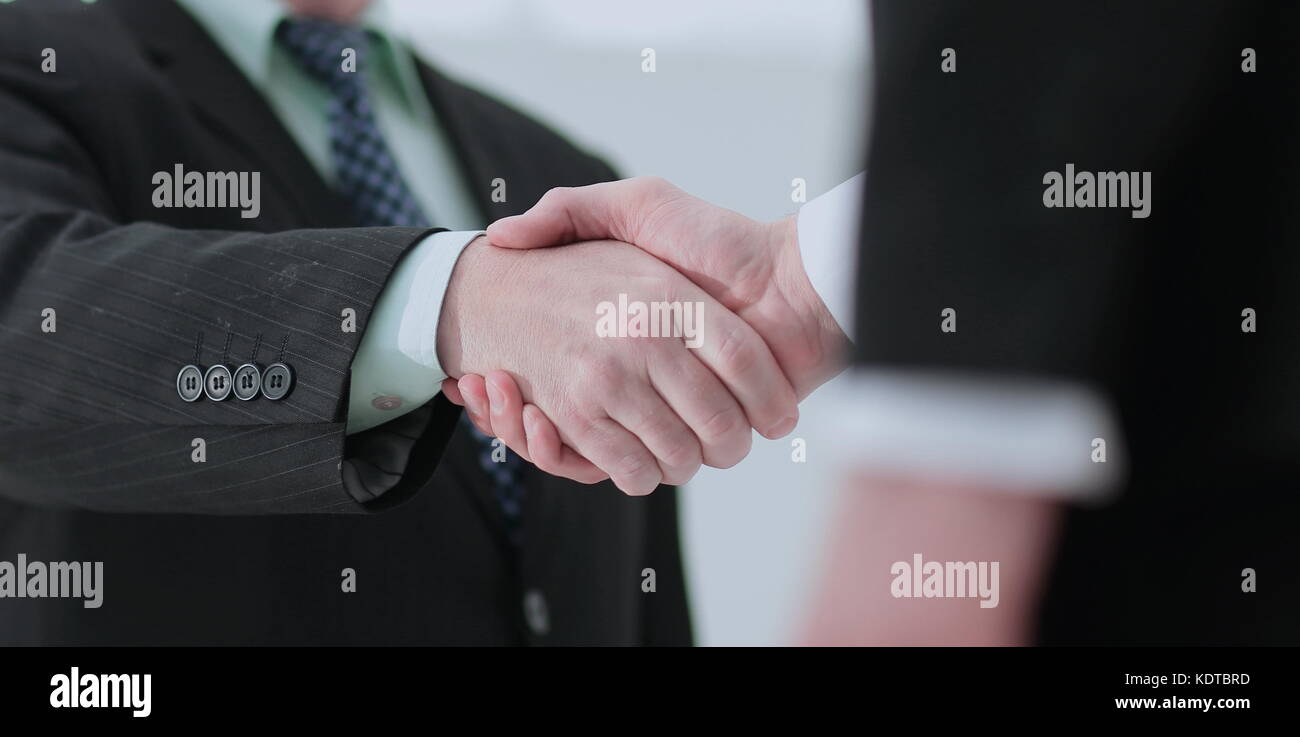Closeup of handshake as a sign of successful cooperation and int Stock ...