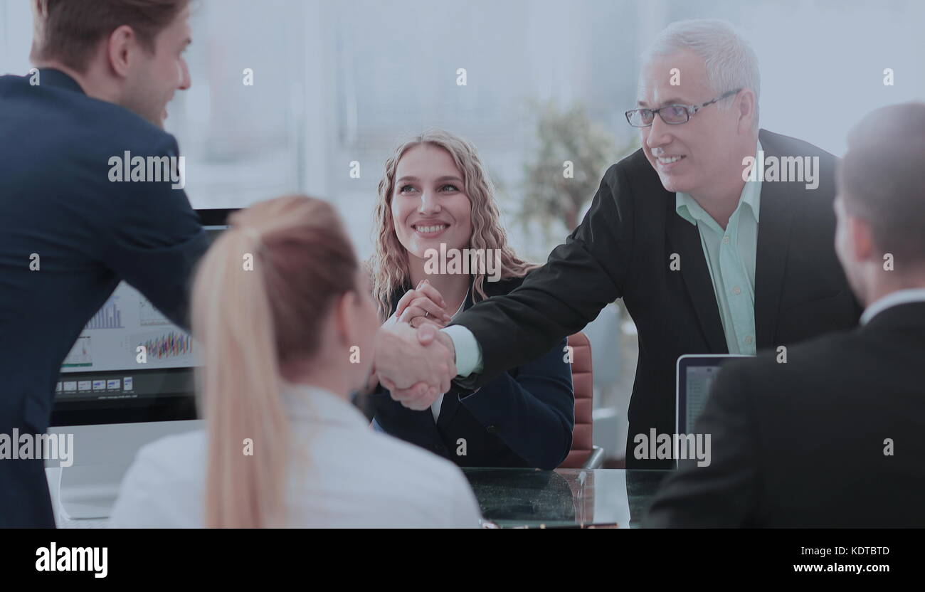 Business partners shaking hands after a successful transaction Stock ...