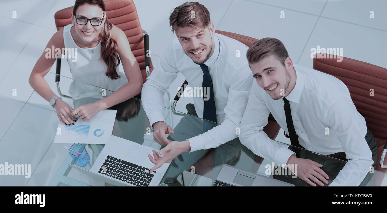Business people working around table in modern office. Top view Stock ...