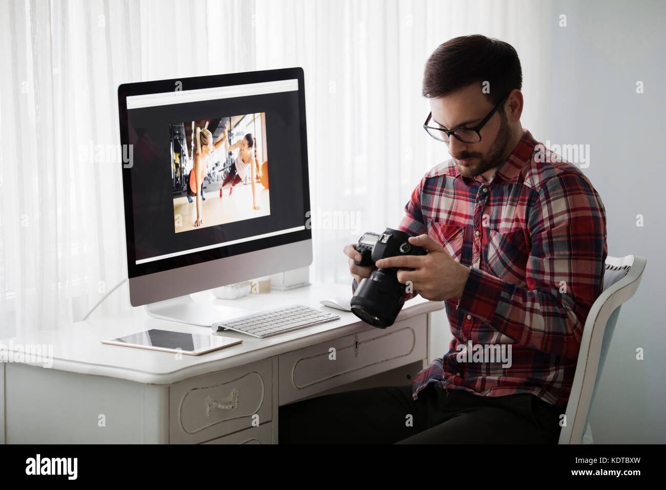 Portrait of young attractive man doing design work Stock Photo - Alamy