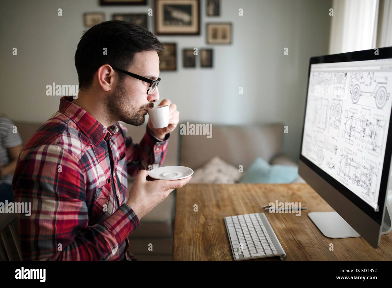 Portrait of young attractive man doing design work Stock Photo - Alamy