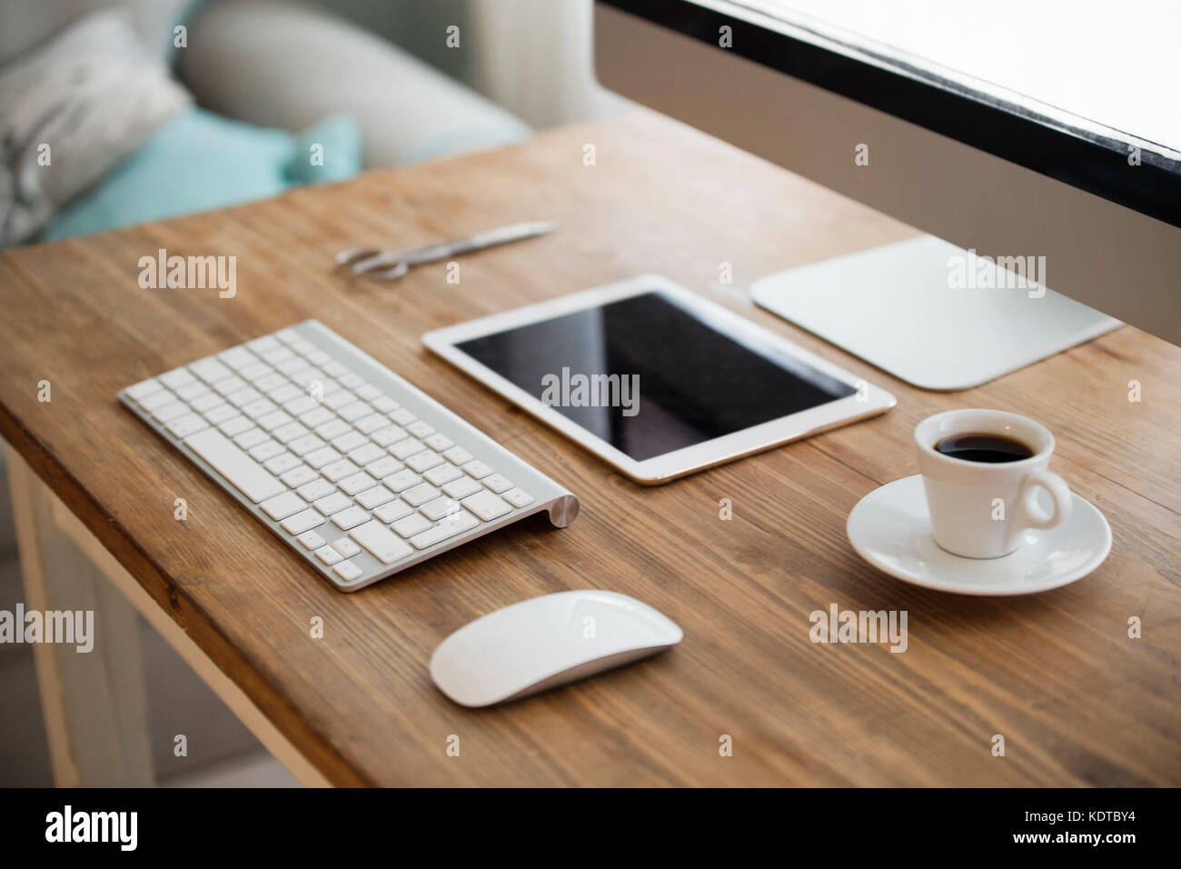 Picture of computer, scissors and camera on working desk Stock Photo ...