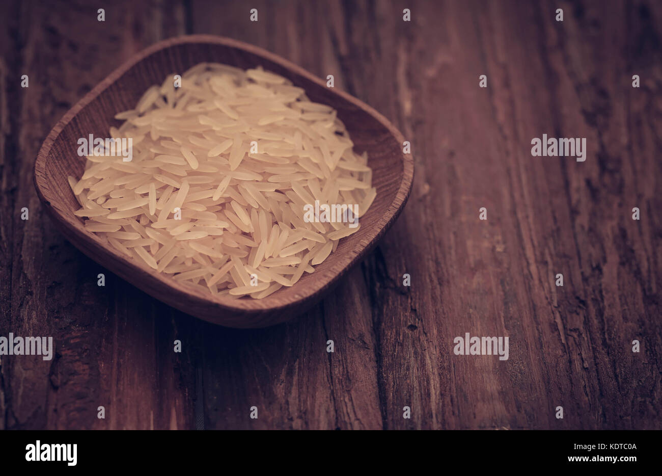 Basmati rice uncooked on natural surface Stock Photo - Alamy