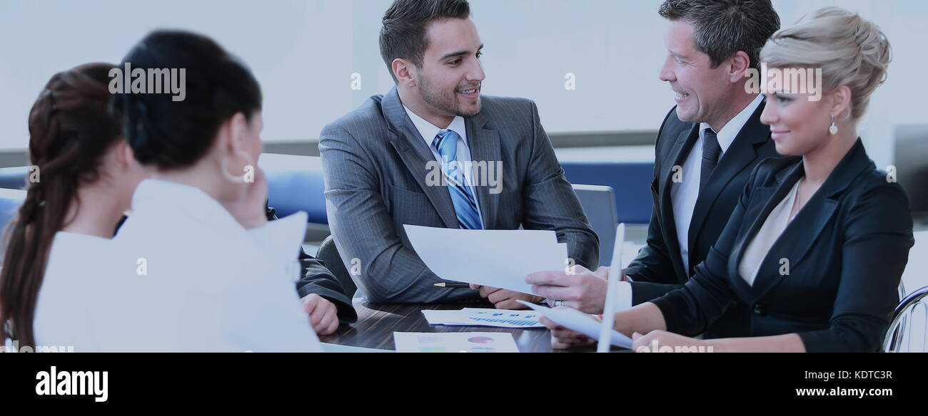 Business people working around table in modern office Stock Photo - Alamy