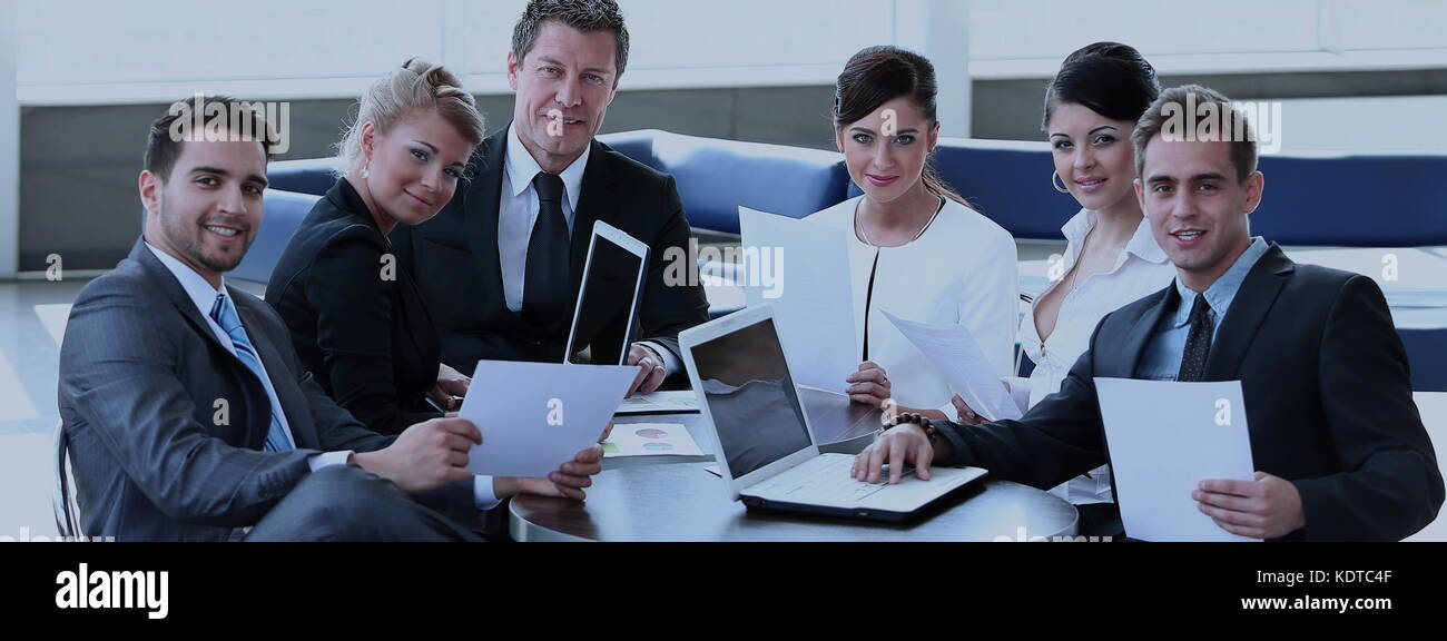 Happy business colleagues at work smiling to camera Stock Photo - Alamy