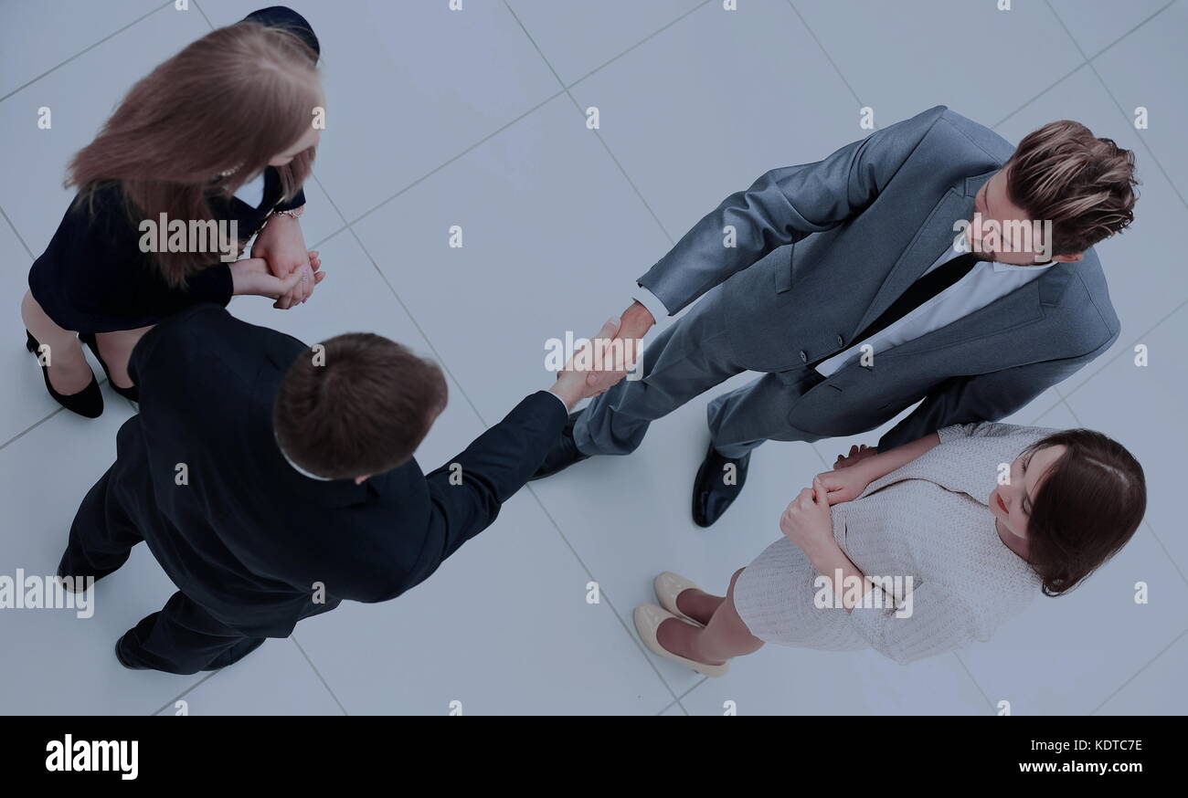 Businessmen shaking hands. Top View Stock Photo - Alamy