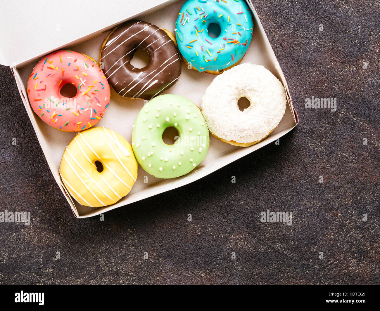 paper box with colorful donuts, top view, copy space Stock Photo - Alamy