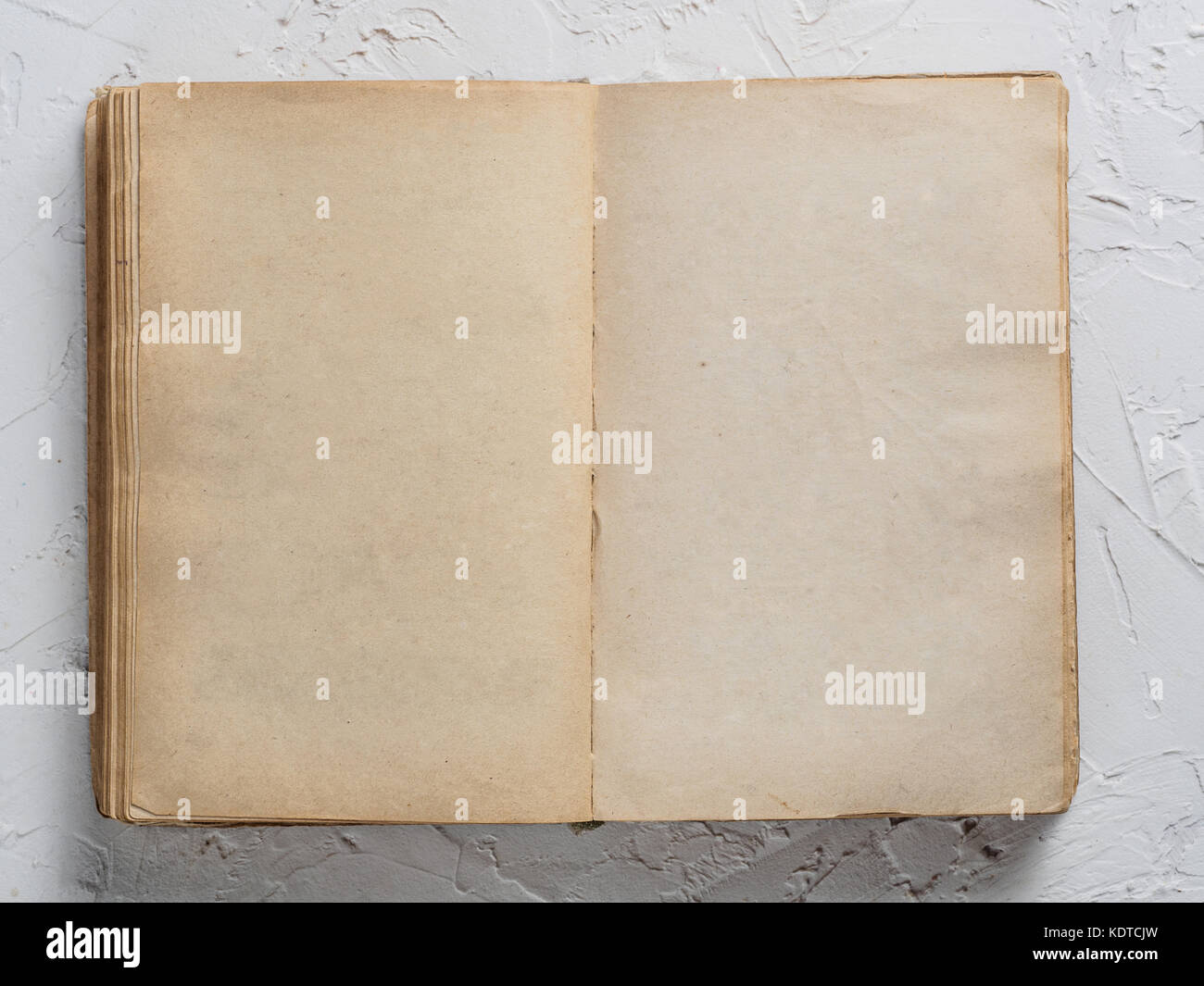 Open book blank on white concrete background Stock Photo - Alamy