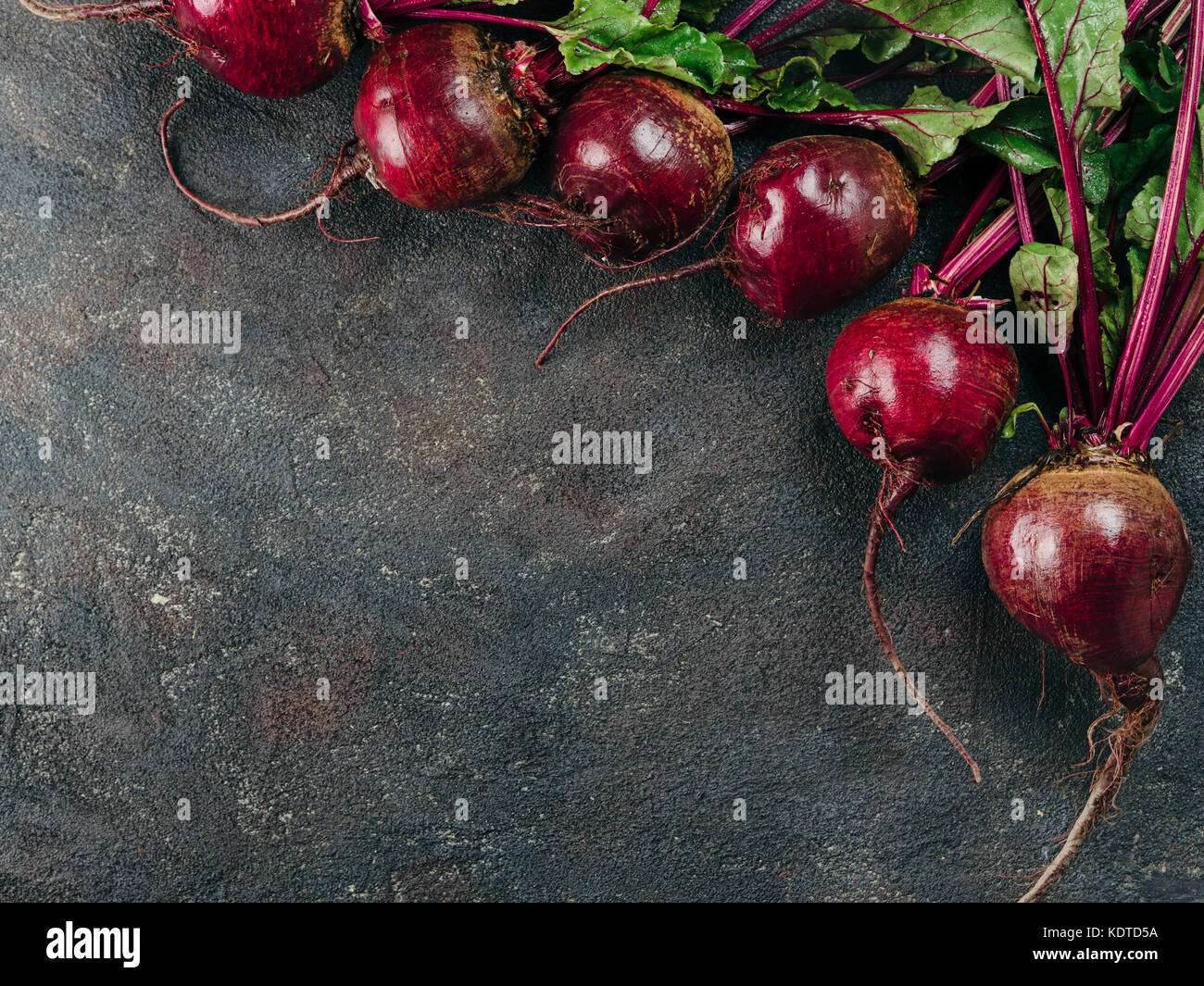 Beet, beetroot bunch on dark background, copy space Stock Photo - Alamy