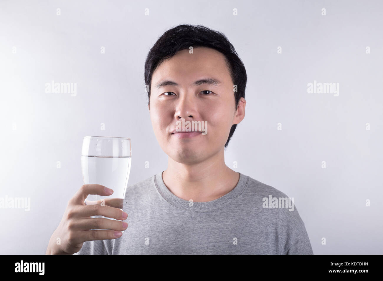 Asian man drinking water Stock Photo - Alamy