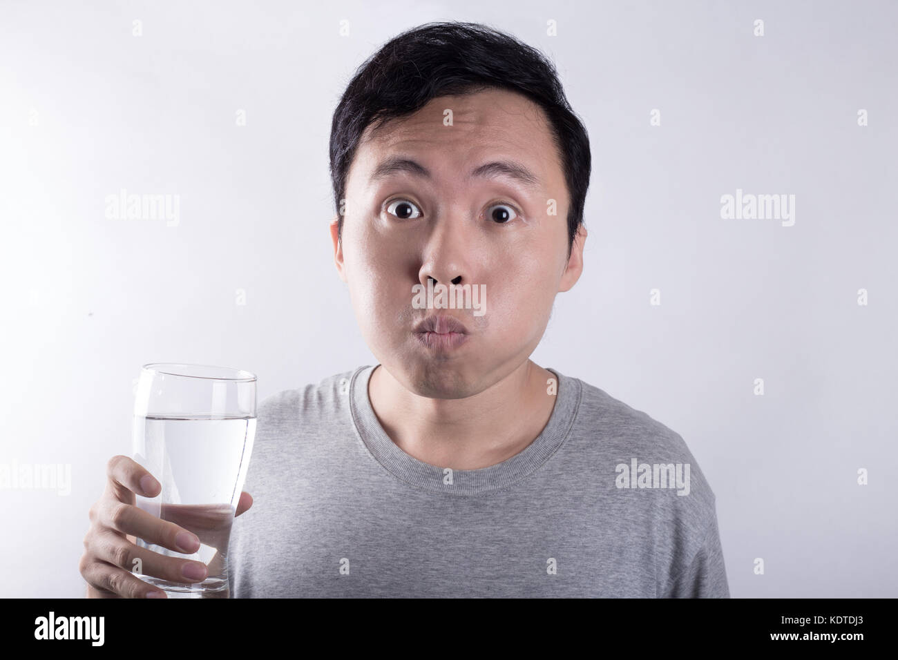 Asian man drinking water Stock Photo - Alamy