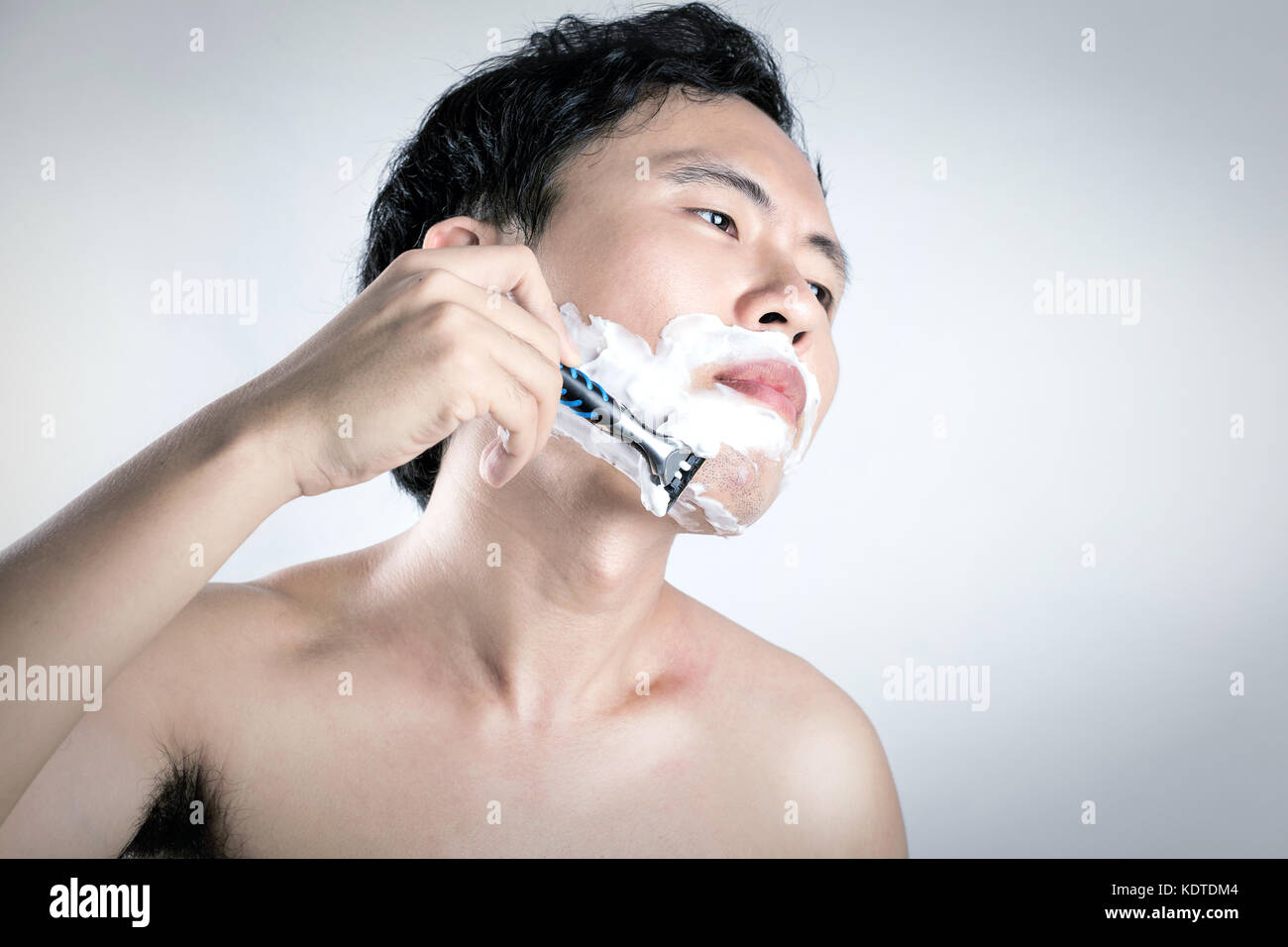 Asian man is shaving Stock Photo - Alamy