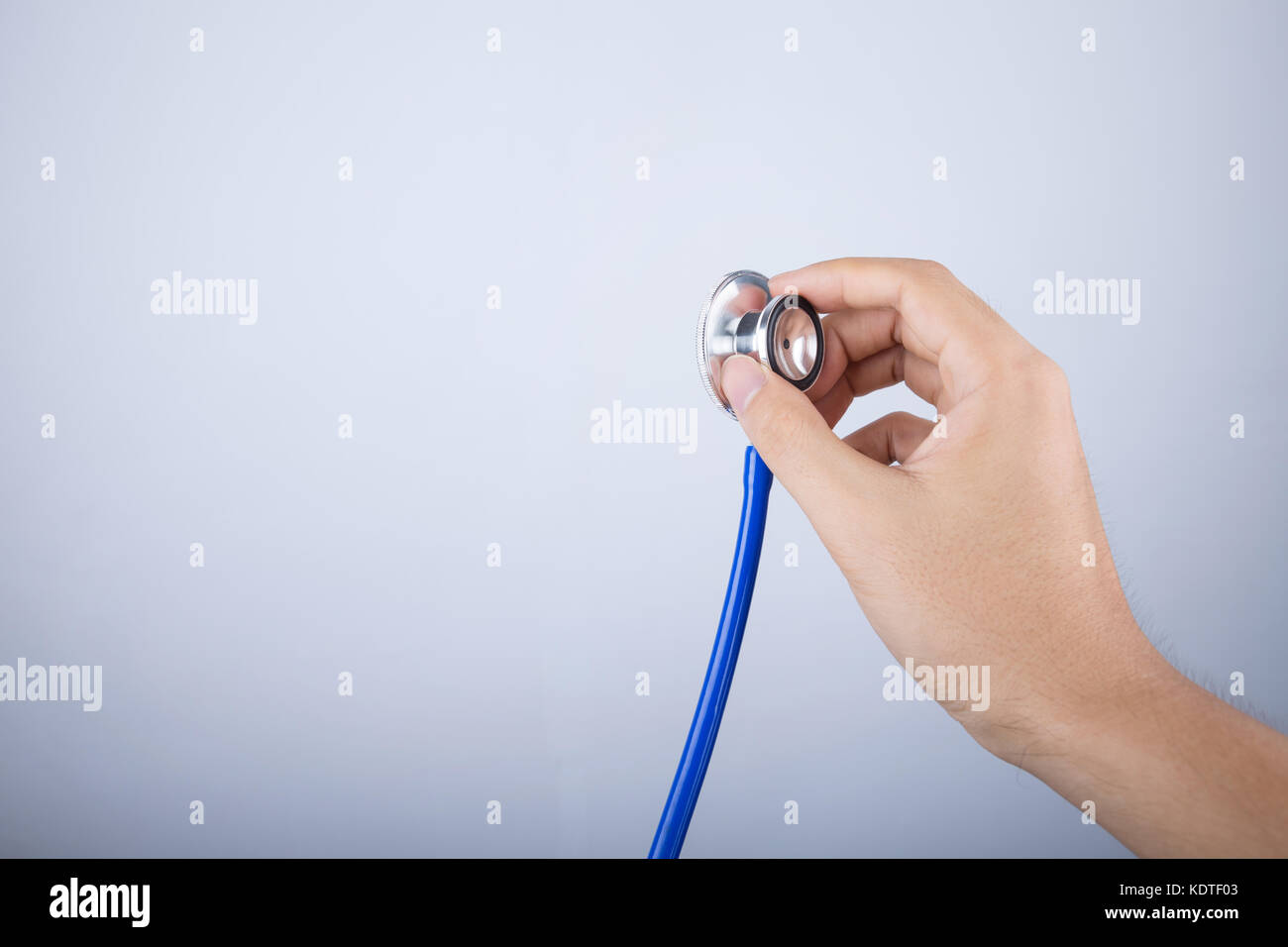 hand holding stethoscope Stock Photo - Alamy