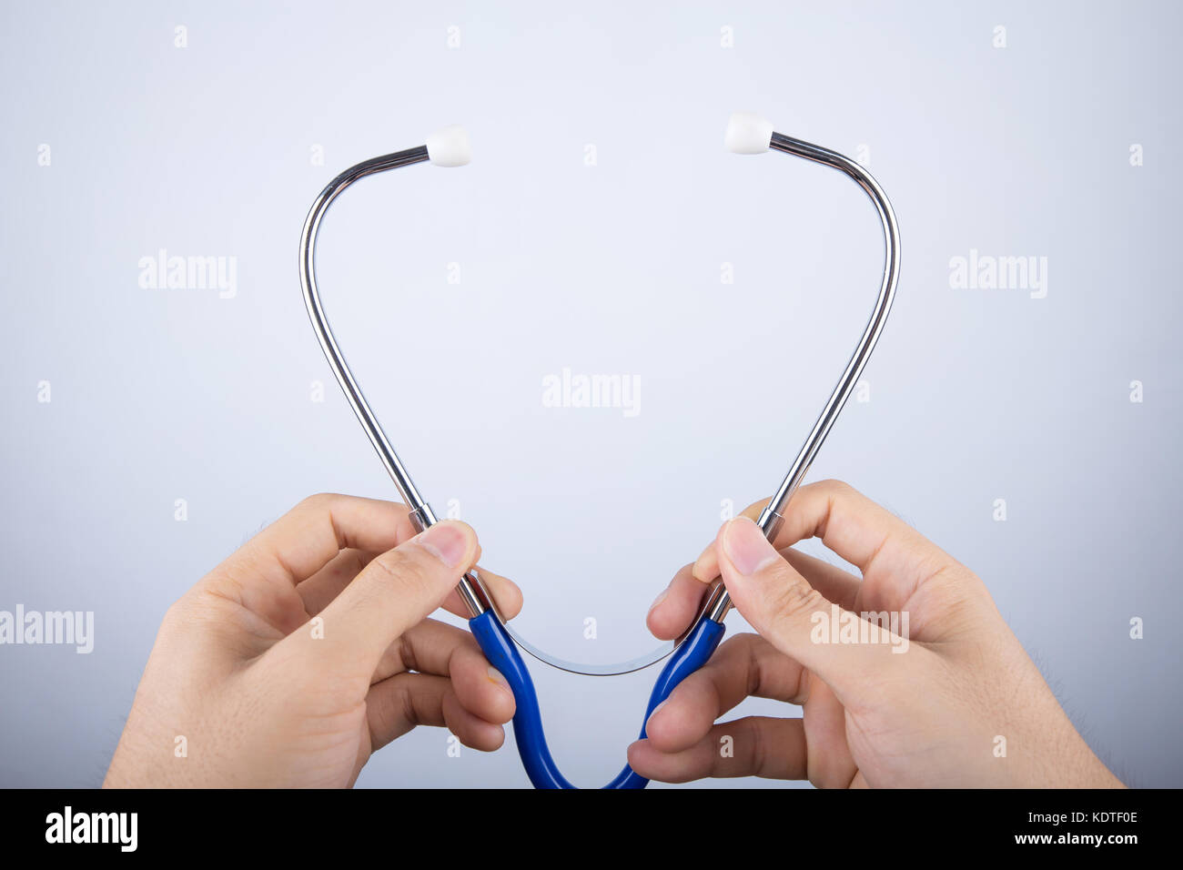 hand holding stethoscope Stock Photo - Alamy