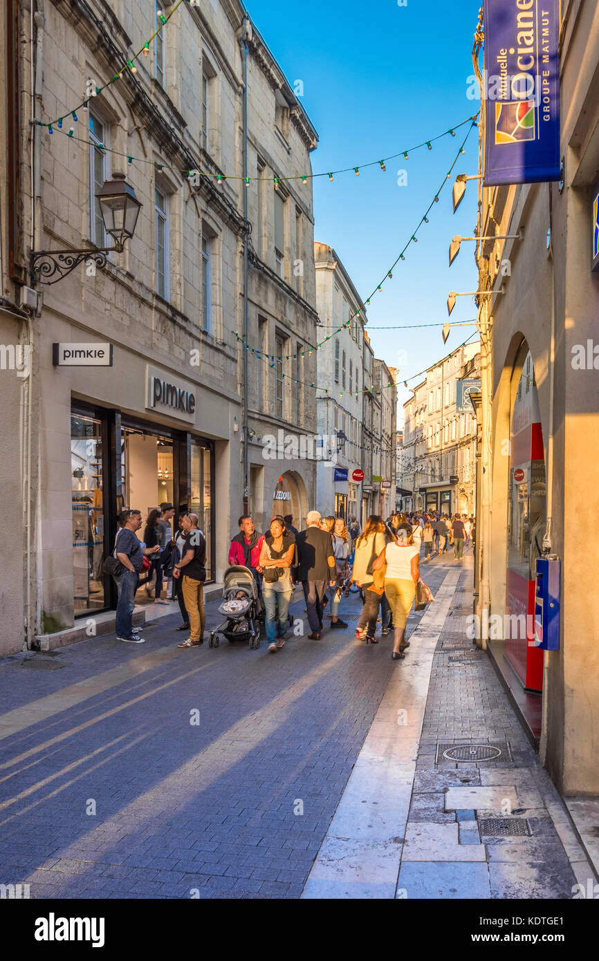 Shoppers in narrow street of the old town, La Rochelle, France Stock ...
