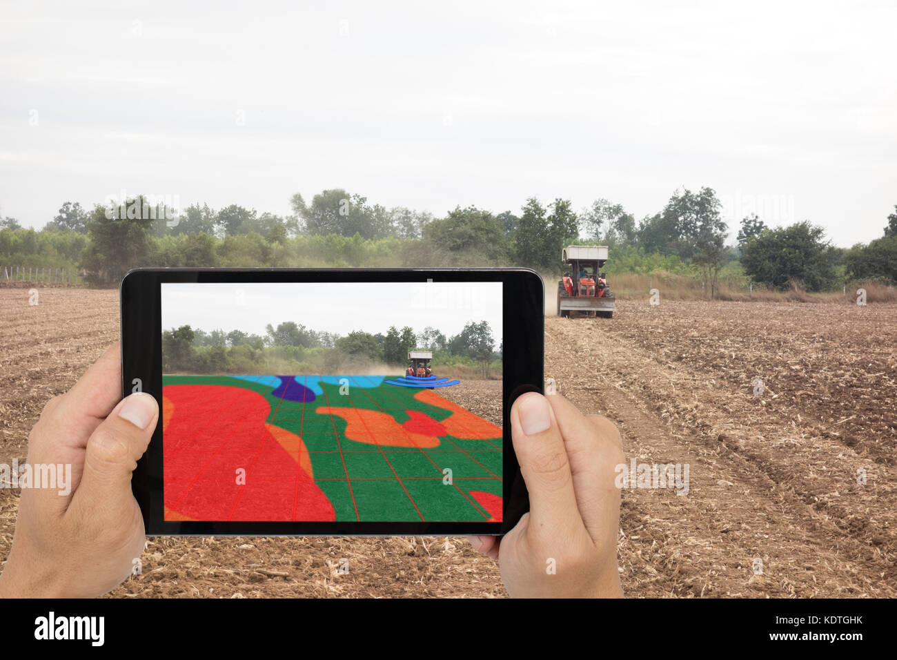 smart agriculture concept, farmer use tablet read infrared in tractor ...