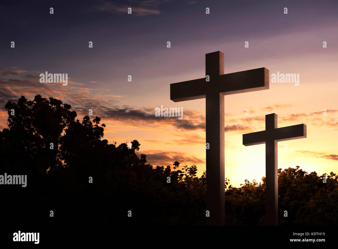 Christian cross in the field with trees over sunset sky background ...