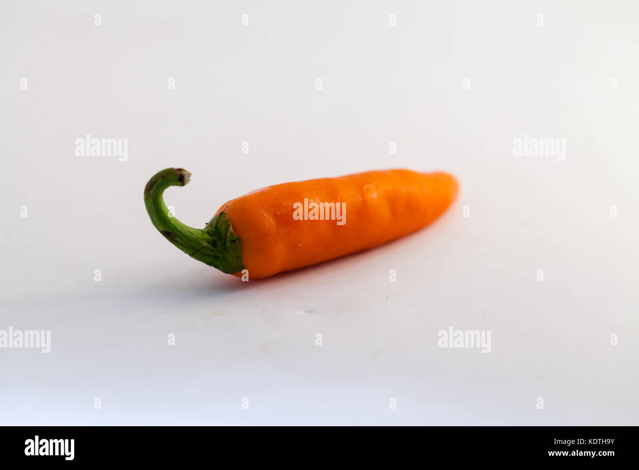orange capsicum isolate on a white background Stock Photo - Alamy