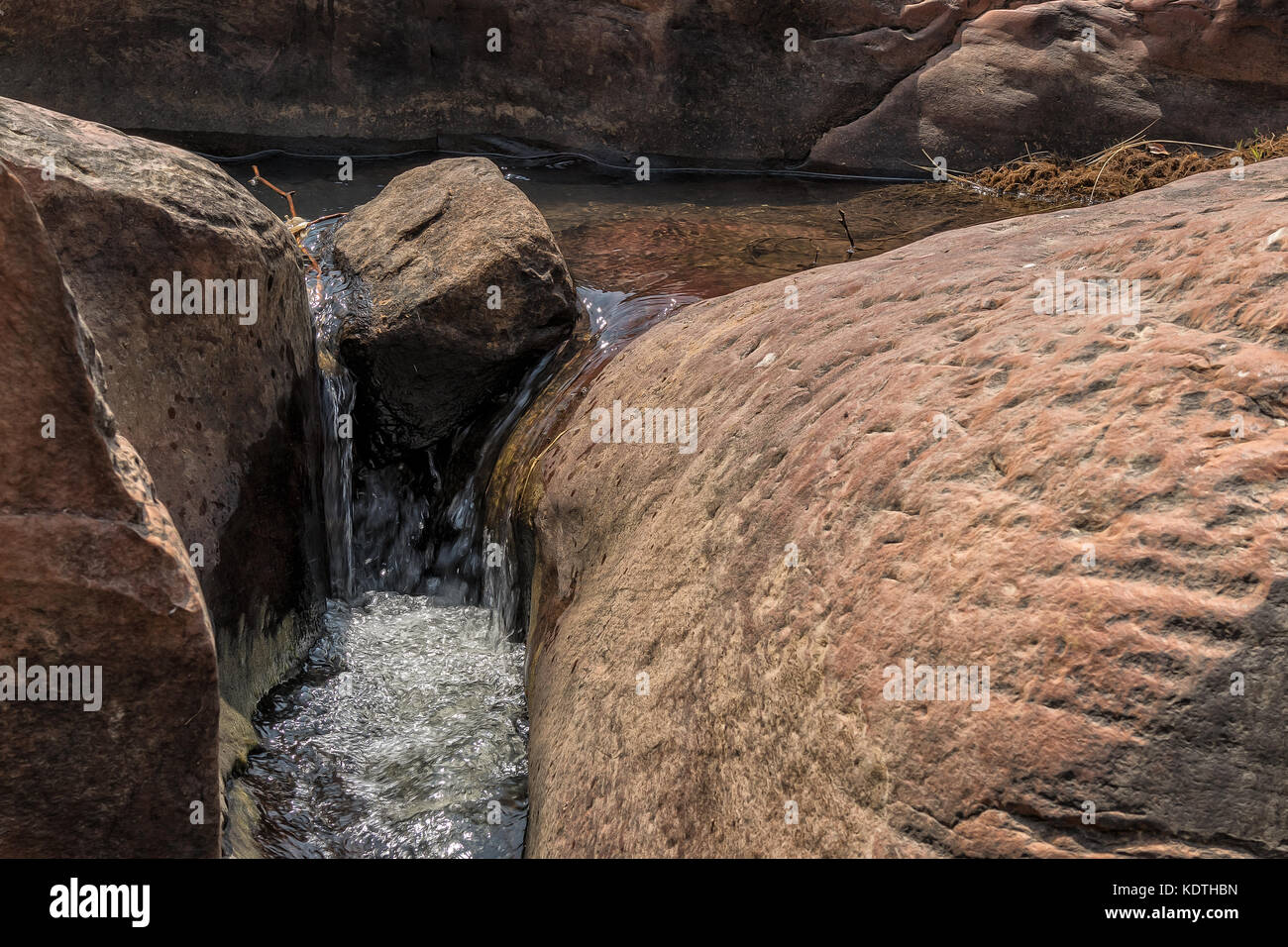 Water flowing through rocks in the canyon of the Leba Range. Angola ...