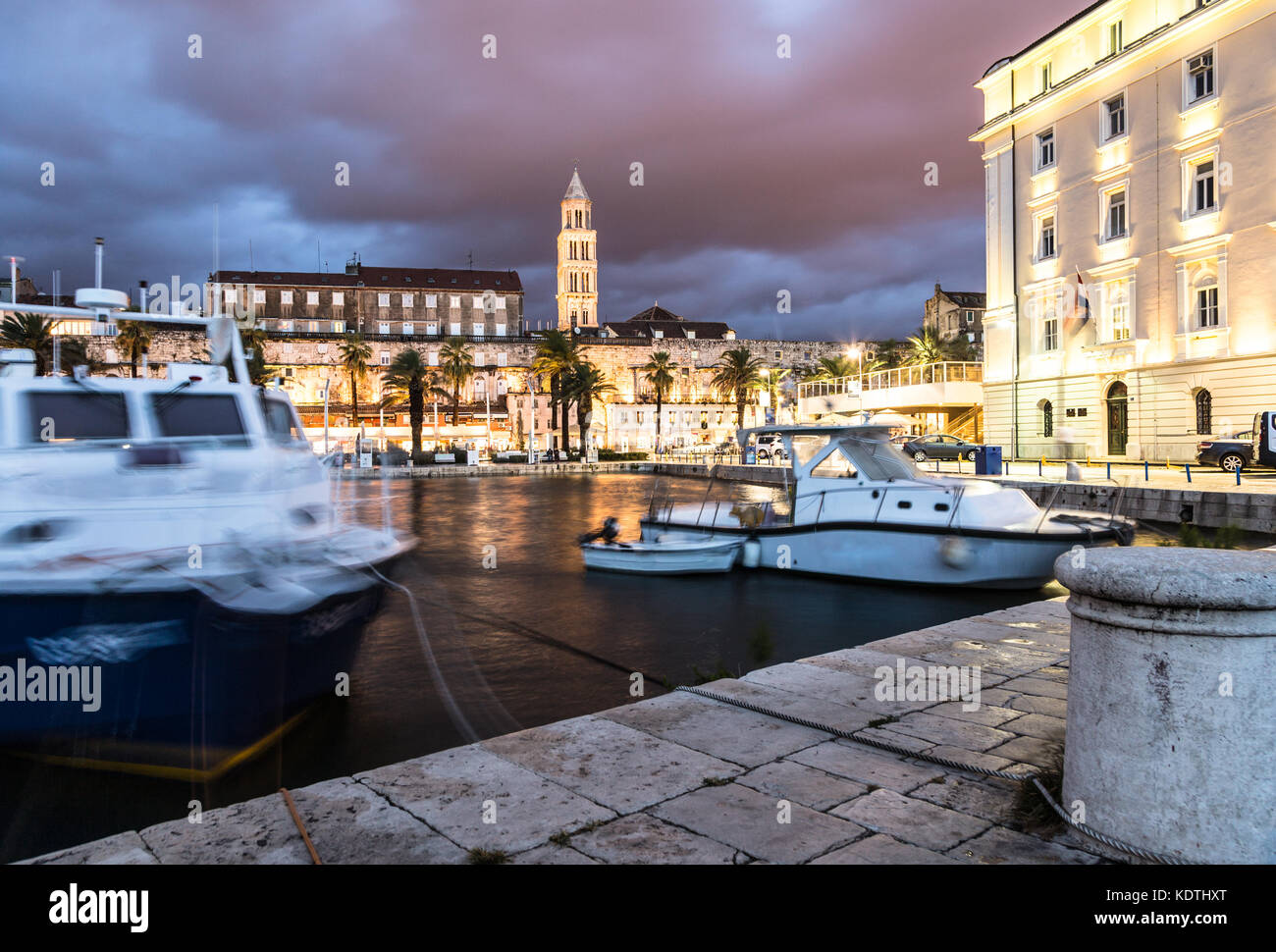 A night view of Split harbor, with boats captured with blurred motion ...