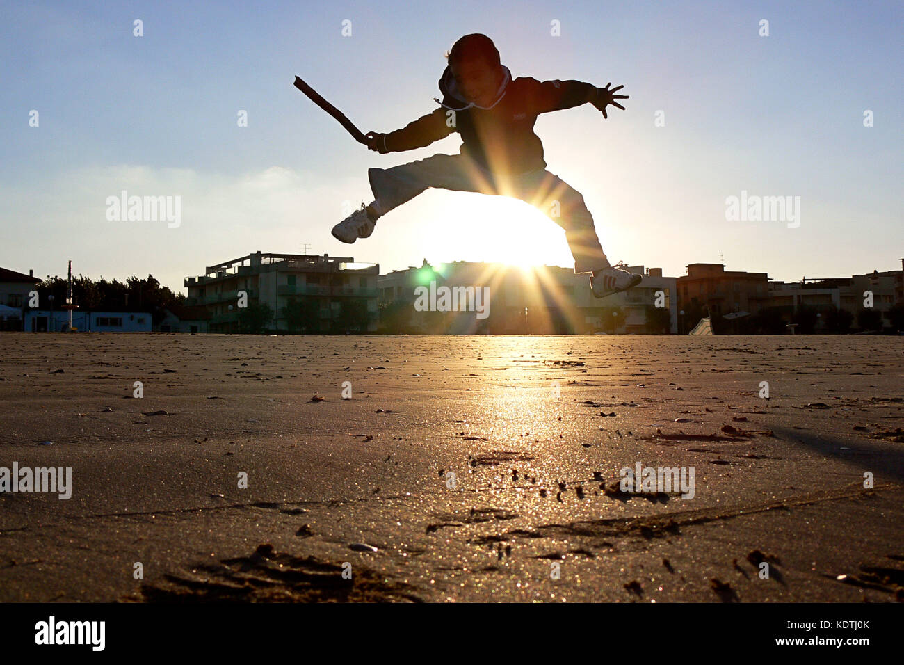 jumping on the sun Stock Photo - Alamy