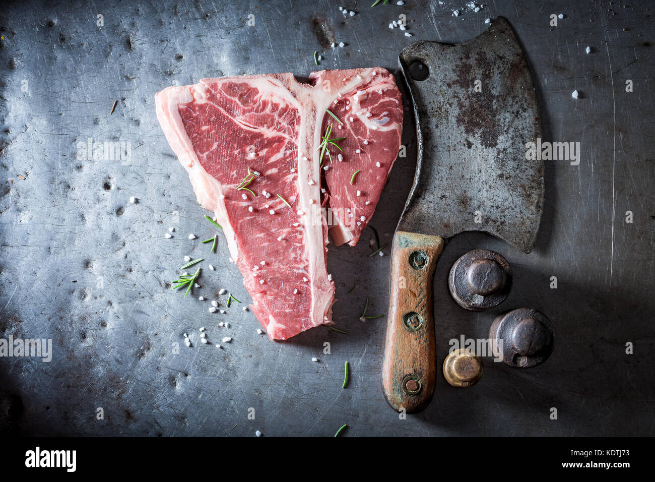 Bloody red steak with salt and rosemary Stock Photo - Alamy