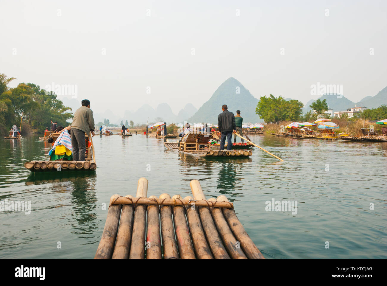 Bamboo raftign along YuLong, Guilin, China - Bamboo rafting along ...