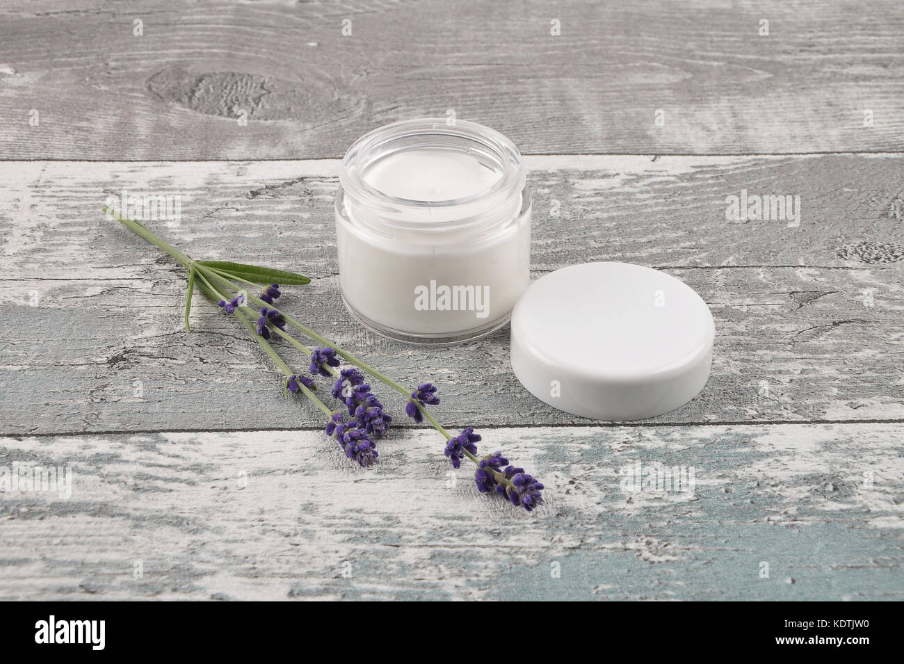 Open moisturizer and lavender on weathered wood Stock Photo - Alamy