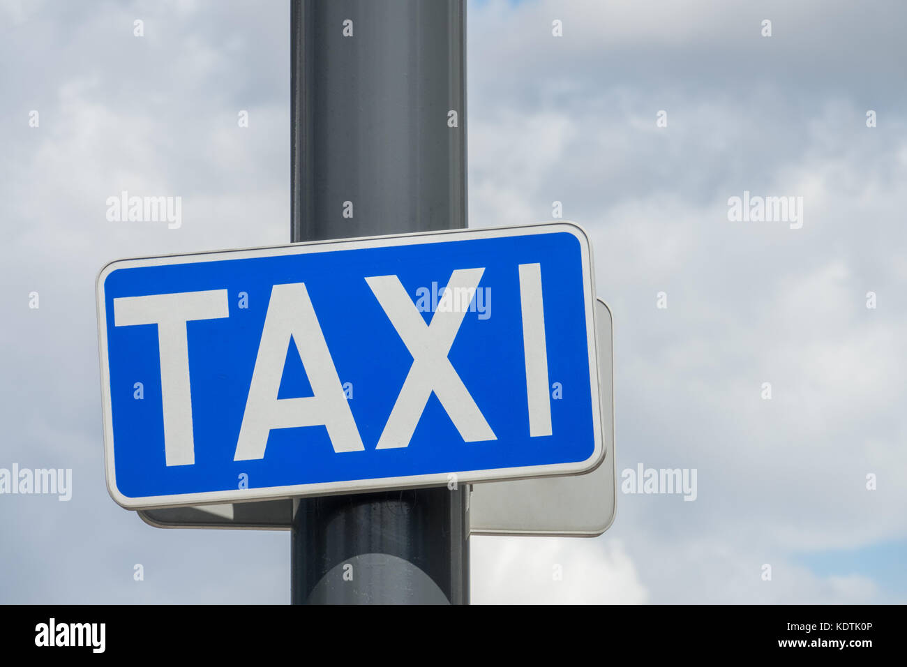 Blue taxi rank sign with the blue cloudy sky in the background Stock ...