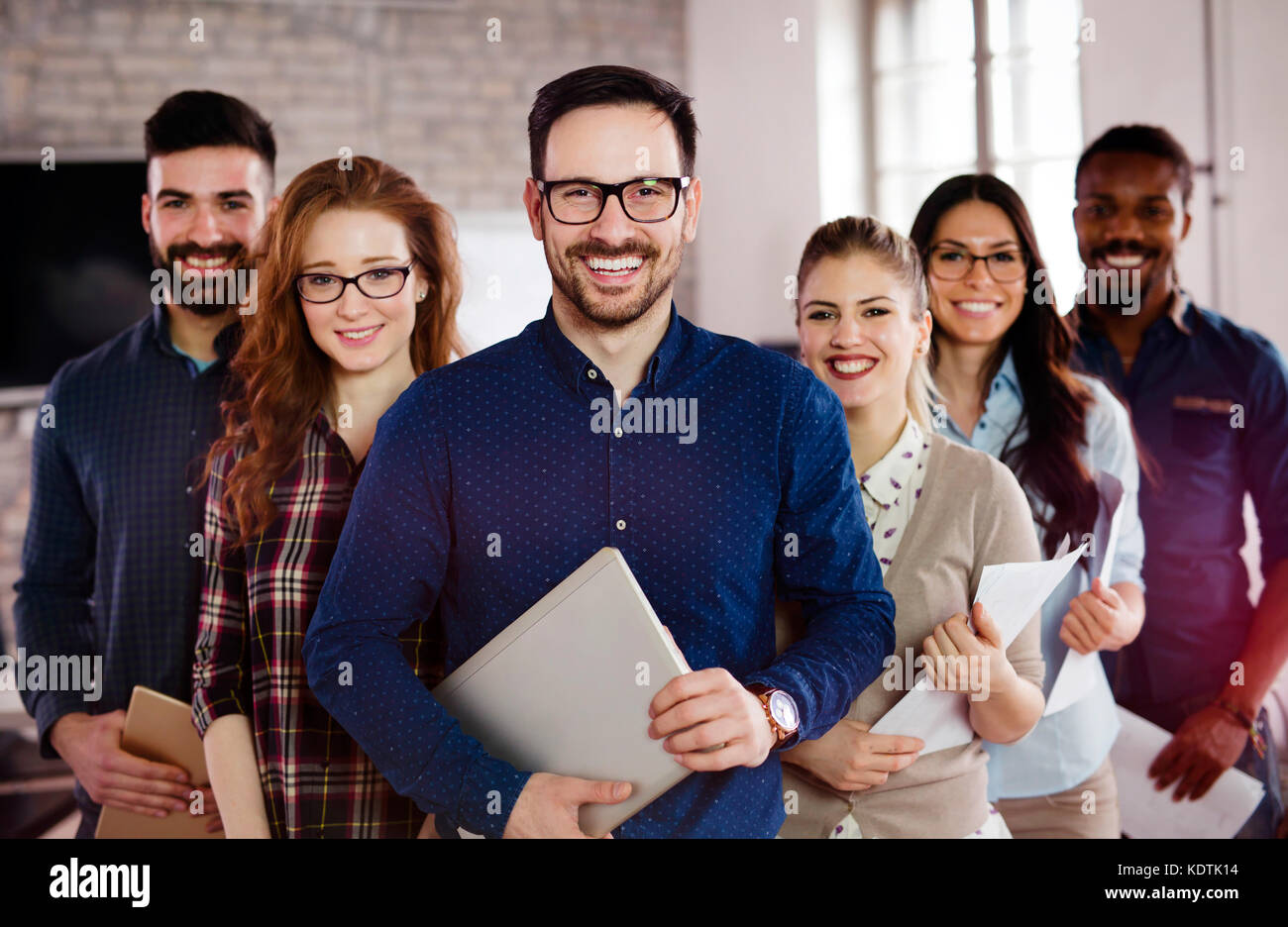 Group picture of team of successful and confident designers Stock Photo ...