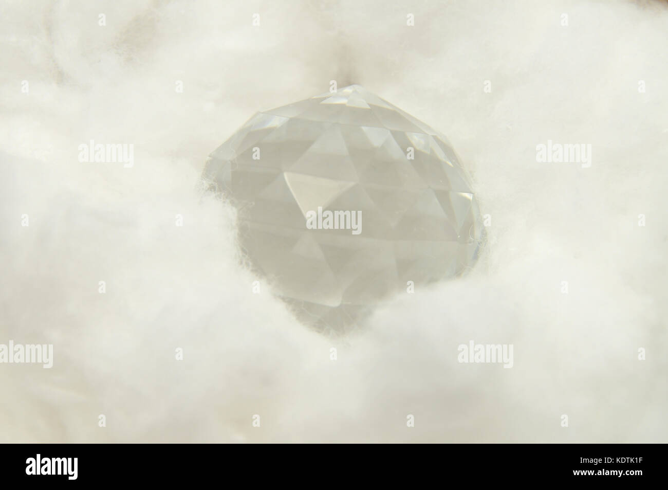 Ball of glass in cotton Stock Photo - Alamy