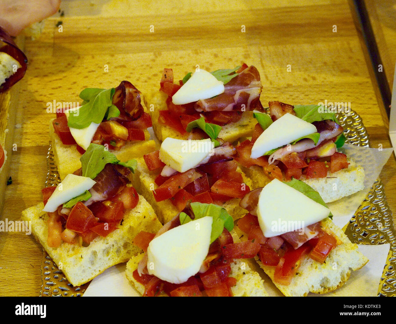 Tomato, serrano ham and cheese canapes Stock Photo - Alamy