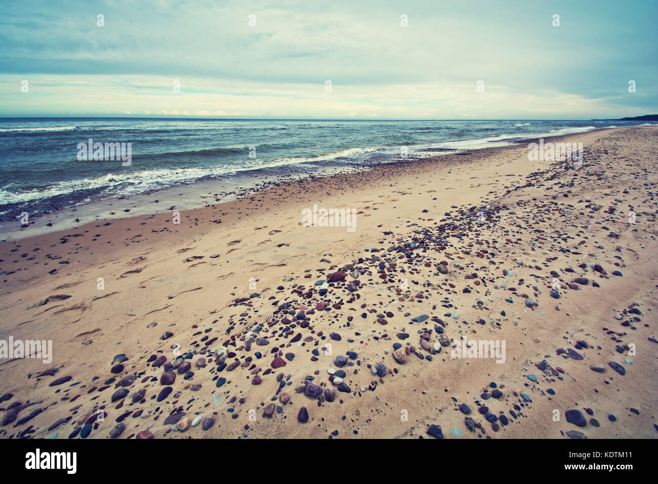 Cold sea in vintage colors. Water sky and beach Stock Photo - Alamy
