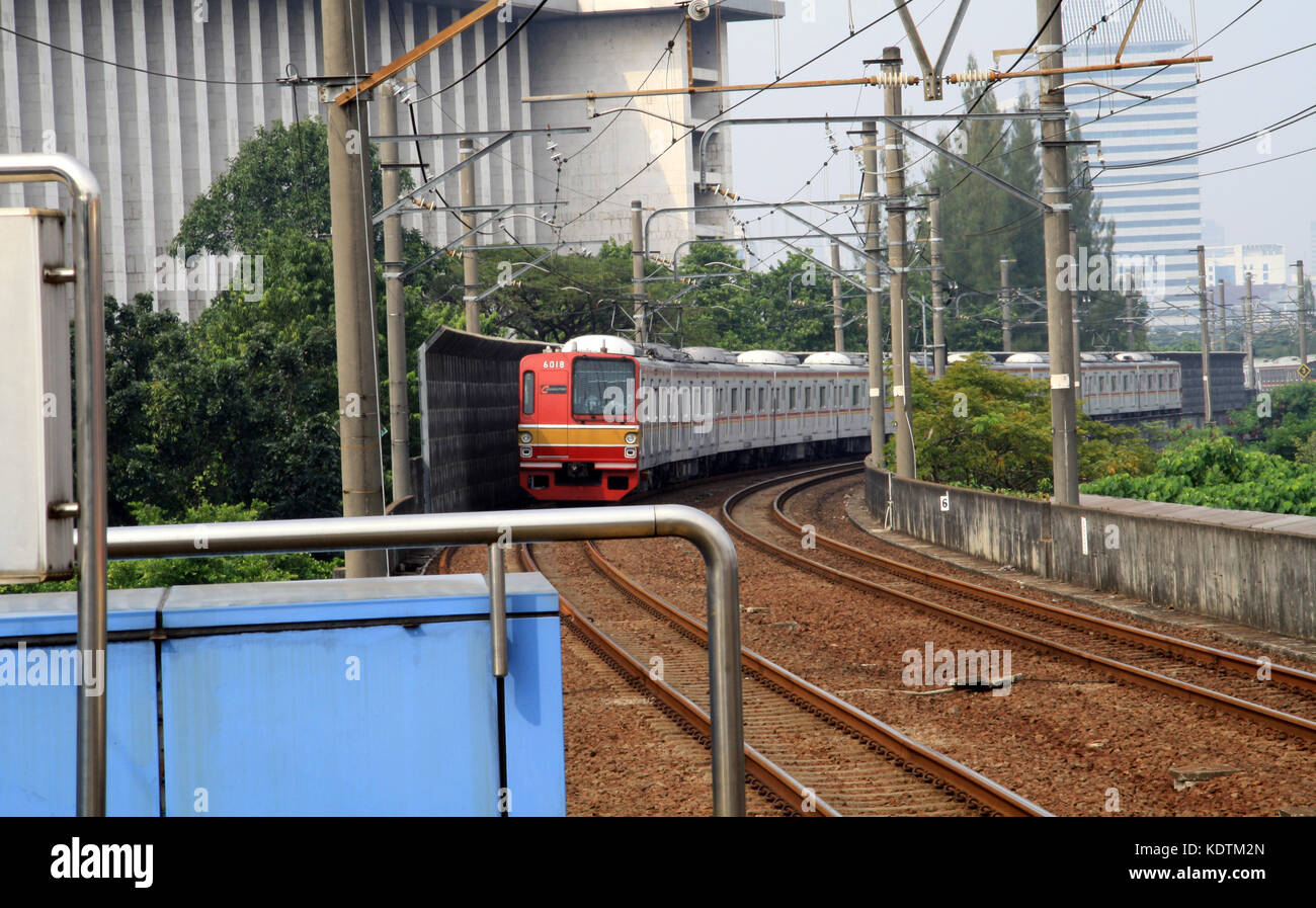 JAKARTA, INDONESIA - JULY 14, 2017: Commuter Line (train) arrive at Juanda railway station ...
