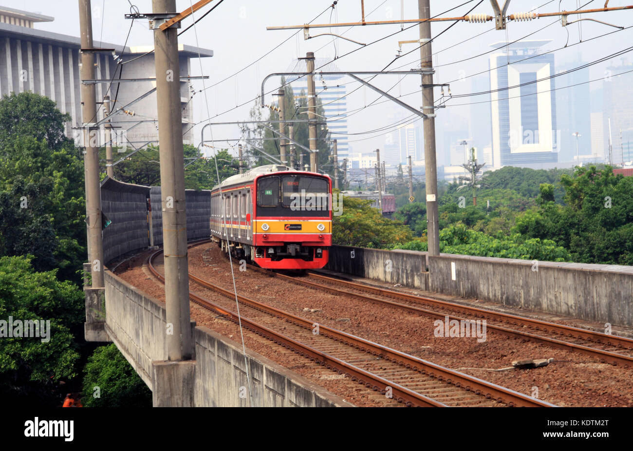 JAKARTA, INDONESIA - JULY 14, 2017: Commuter Line (train) arrive at Juanda railway station ...