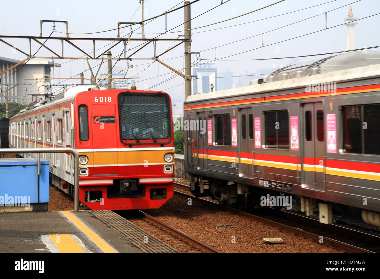 JAKARTA, INDONESIA - JULY 14, 2017: Commuter Line (train) arrive at Juanda railway station ...