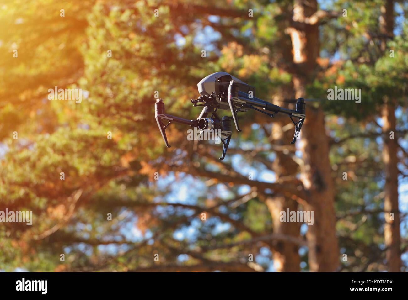 Flying drone on natural background Stock Photo - Alamy