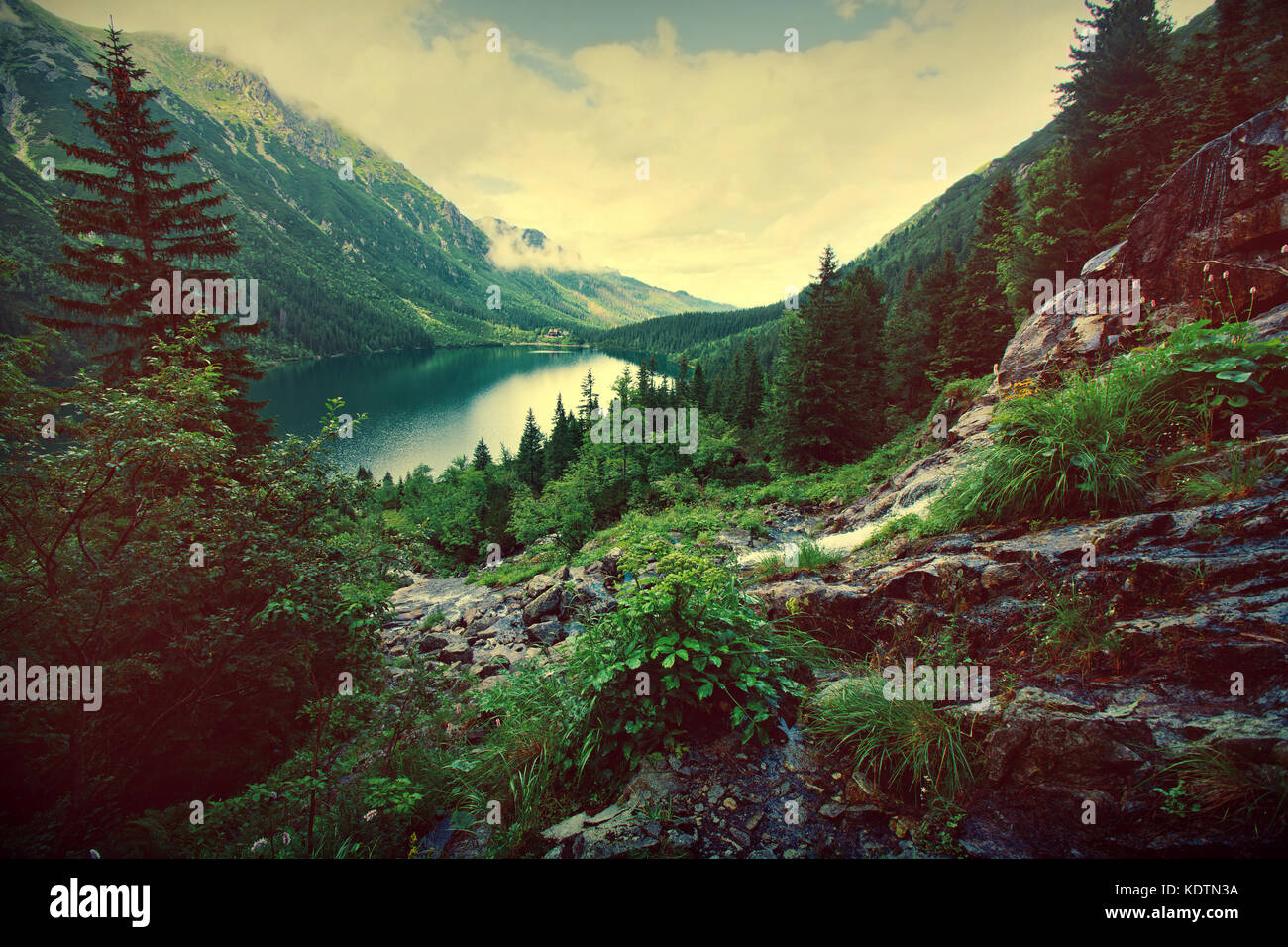 Lake in mountains. Fantasy and colorfull nature landscape. Retro ...